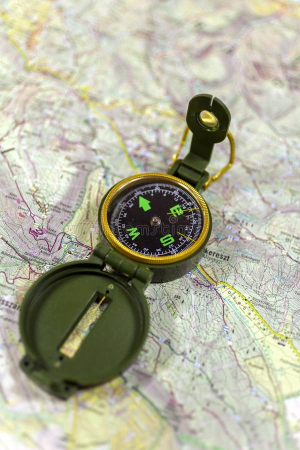 Compass on a paper map stock image. Image of north, longitude - 309446919