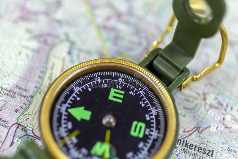 Compass on a paper map stock image. Image of vintage - 309446937