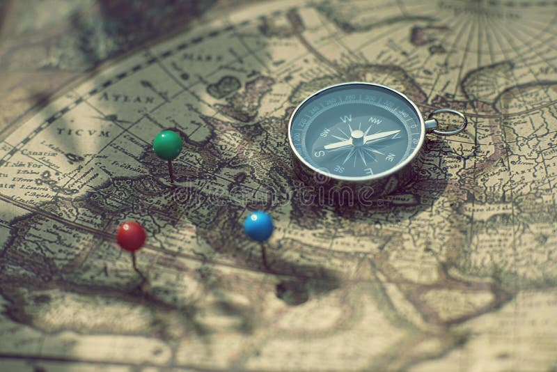 Compass and Pin Point Marking with Vintage Map Background Stock Photo ...