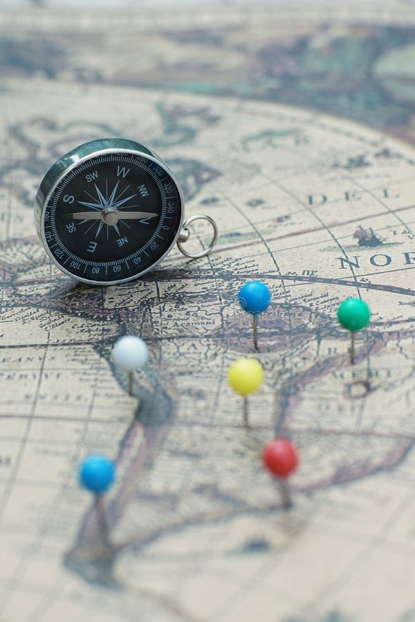 Compass and Pin Point Marking with Vintage Map Background Stock Photo ...