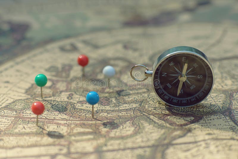 Compass and Pin Point Marking with Vintage Map Background Stock Photo ...