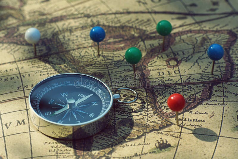 Compass and Marking Pins on Blur Vintage World Map, Journey Concept ...