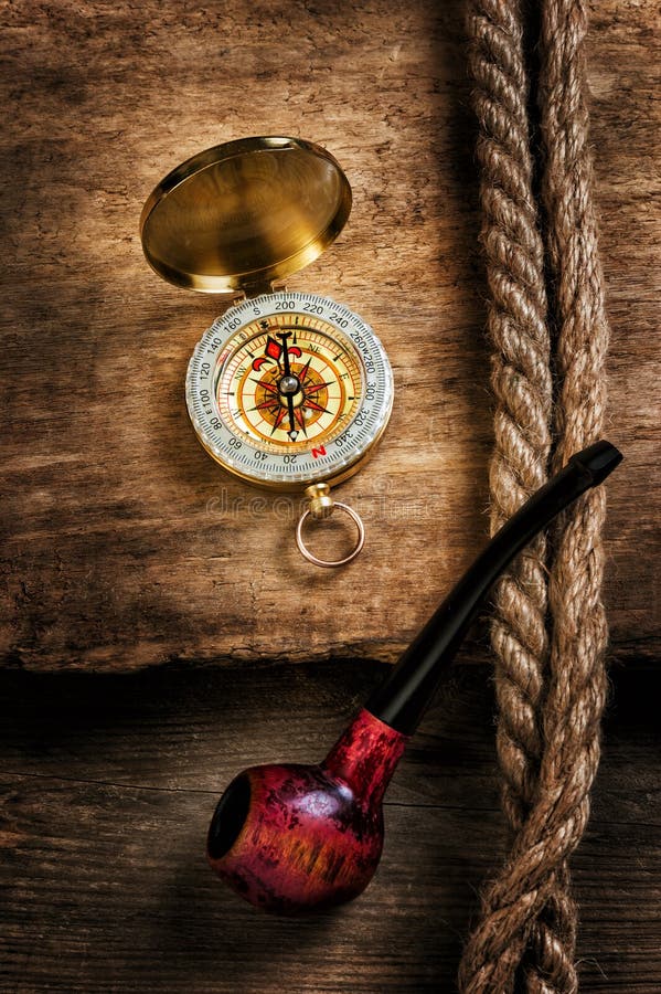 Compass and a Pipe with a Rope Stock Photo - Image of holiday, border ...