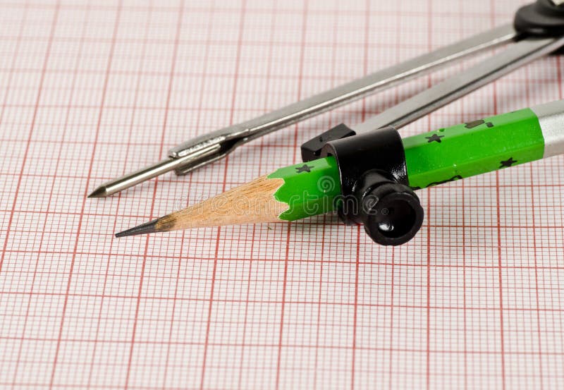 A Compass Placed on a Graph Paper Stock Image - Image of blueprint ...