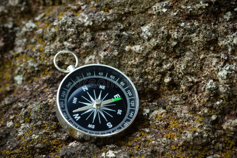 Compass Placed on the Rock in Forest. Stock Image - Image of compass ...