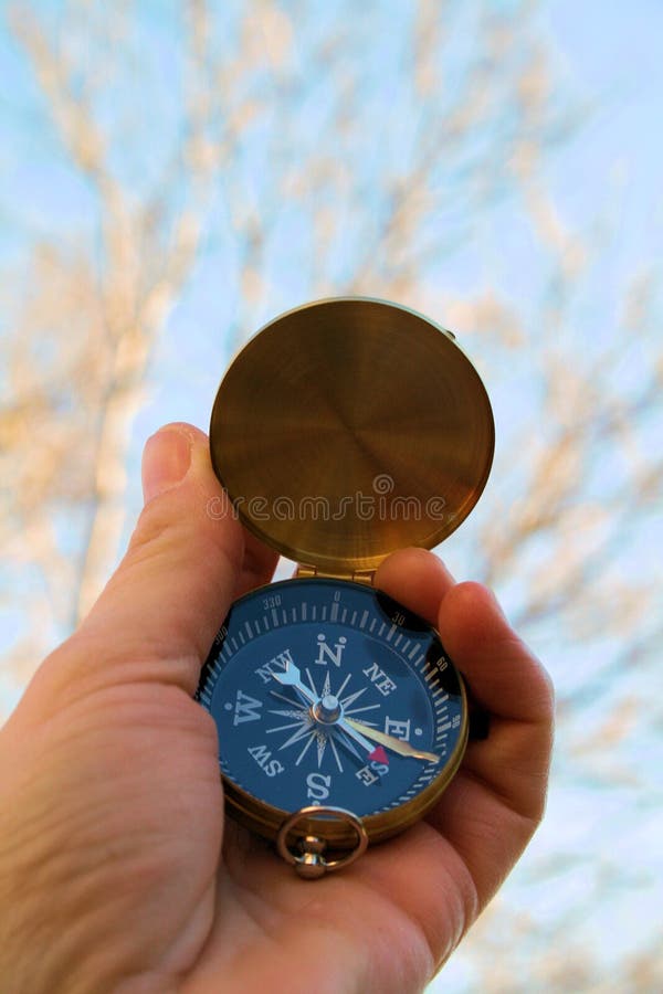 Compass pointing east stock image. Image of survive, brass - 4392901