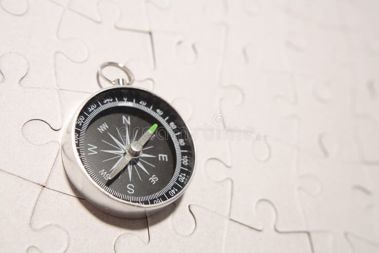 Compass on puzzle stock photo. Image of pieces, puzzle - 6782720