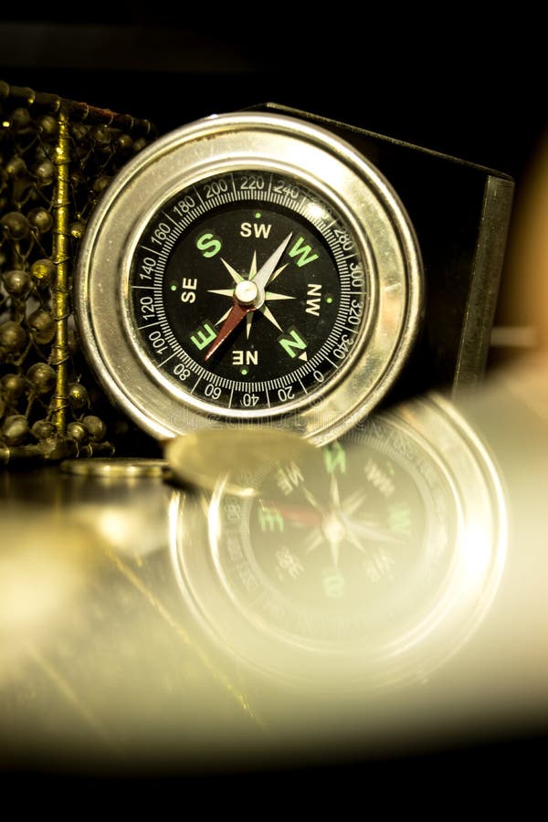 Compass Reflection on the Foreground. Stock Image - Image of instrument ...