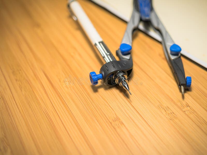 A Compass Resting on a Study Table. Stock Photo - Image of revision ...