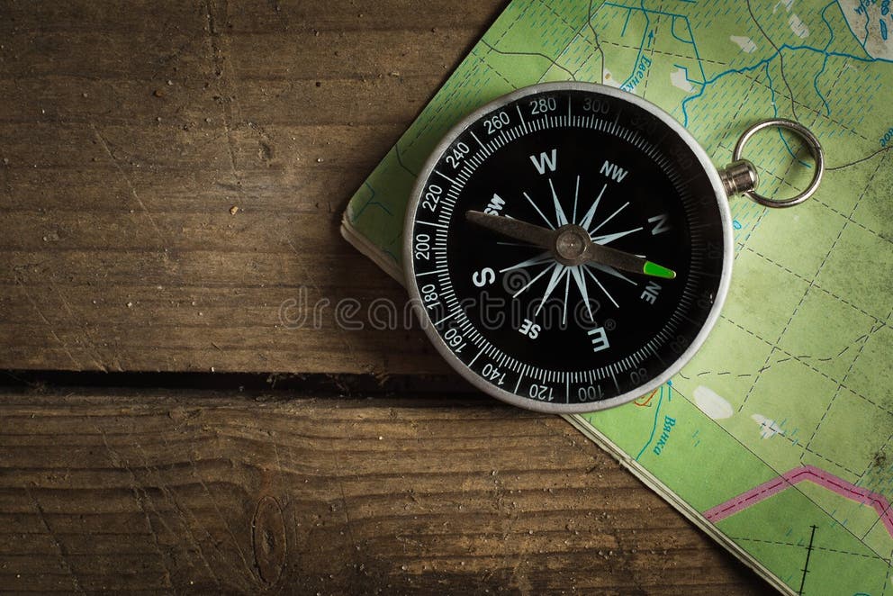 Compass on a road map stock image. Image of road, longitude - 28247439