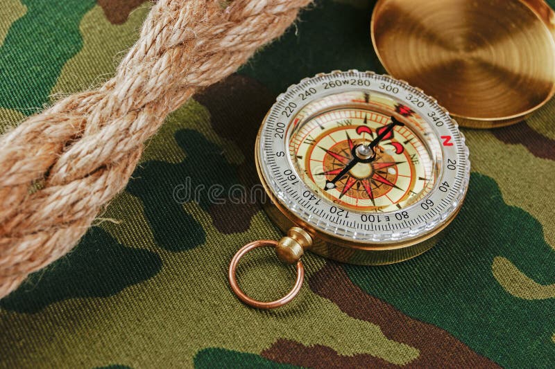 Compass and rope on map stock photo. Image of scout, east - 27907072
