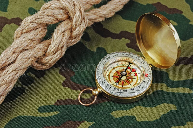 Compass and rope on map stock photo. Image of scout, east - 27907072