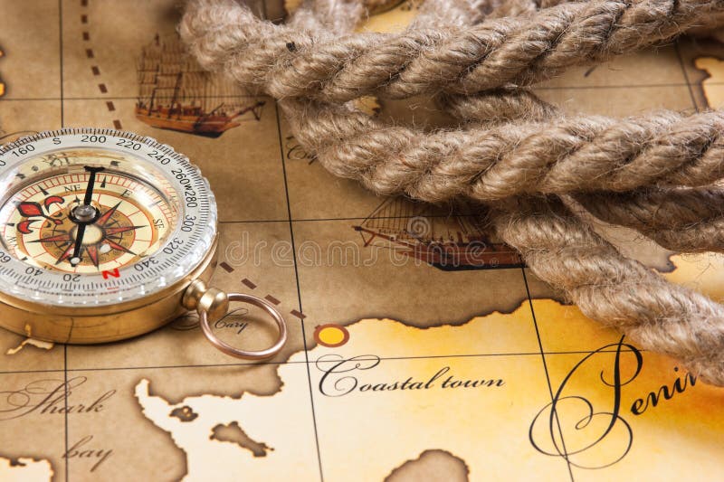 Compass and rope on map stock image. Image of rope, explorer - 124499463