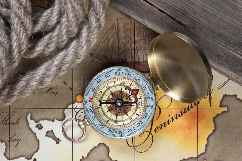Compass and rope on map stock photo. Image of scout, east - 27907072