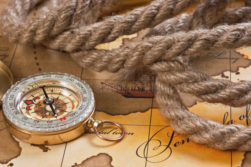 Compass and rope on map stock image. Image of cartography - 174321809