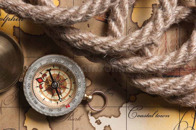 Compass and rope on map stock image. Image of rope, sign - 174322021