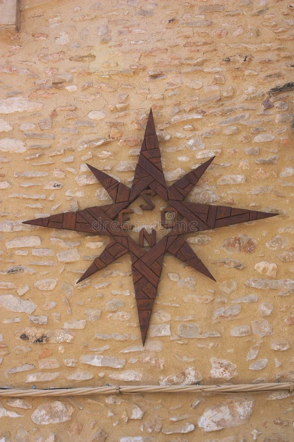 Compass Rose Made of Wood that Decorates a Stone Wall Stock Image ...