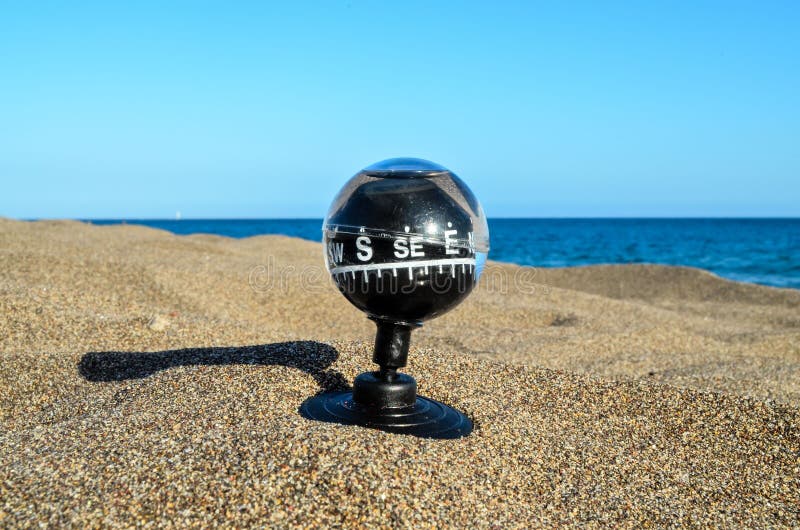 Compass on the Sand Beach stock image. Image of north - 157622395