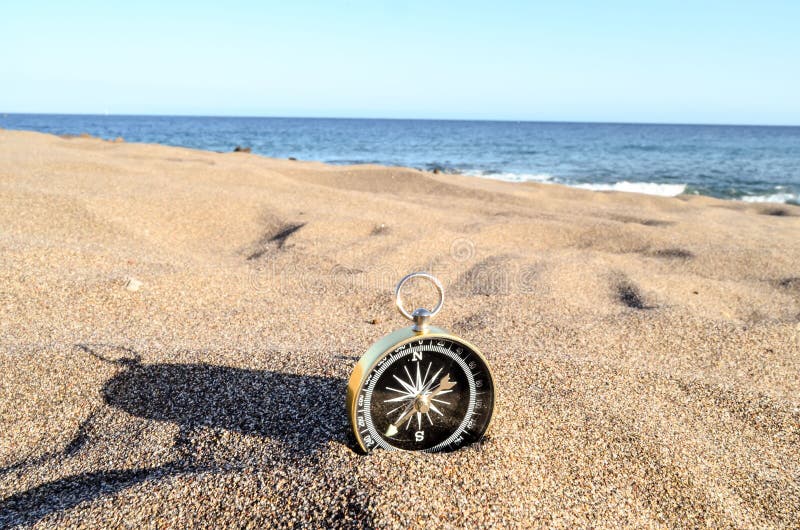 Compass on the Sand Beach stock image. Image of sand - 199536089