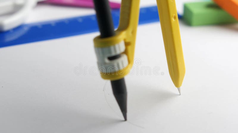A CloseUp View Showing a Compass and Pencil Placed on Blank Drawing ...