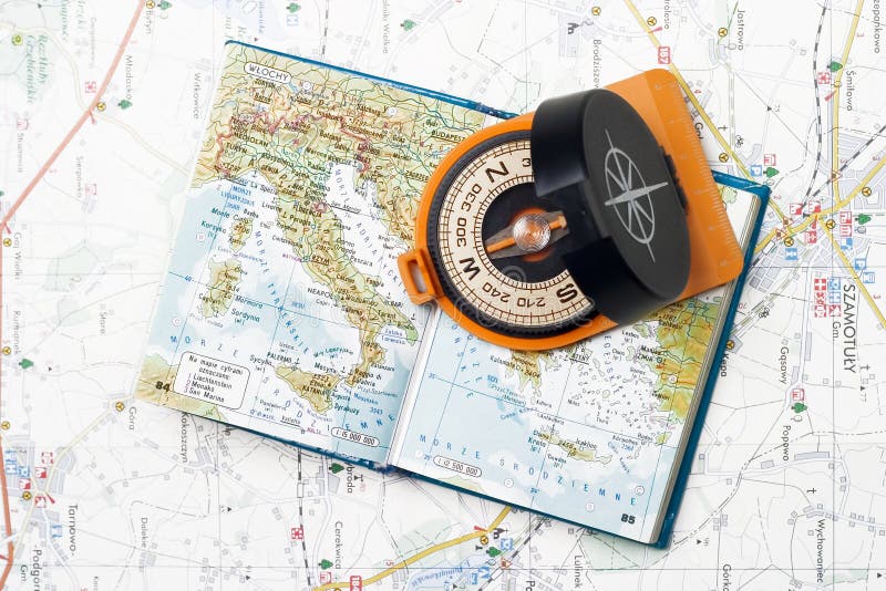 Compass and small atlas stock photo. Image of symbolic - 4817910
