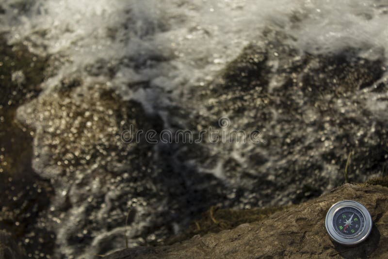 Compass on a Stone Near the River Stock Photo - Image of adventure ...
