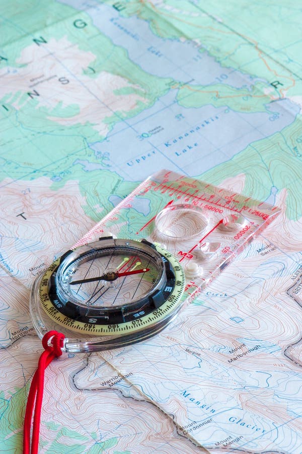 Compass and a Topographic Map Stock Photo - Image of hiking, direction ...