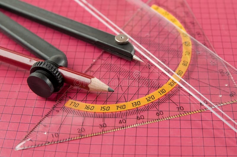 Compass, Triangle and Ruler on Grainy Red Paper Stock Photo - Image of ...