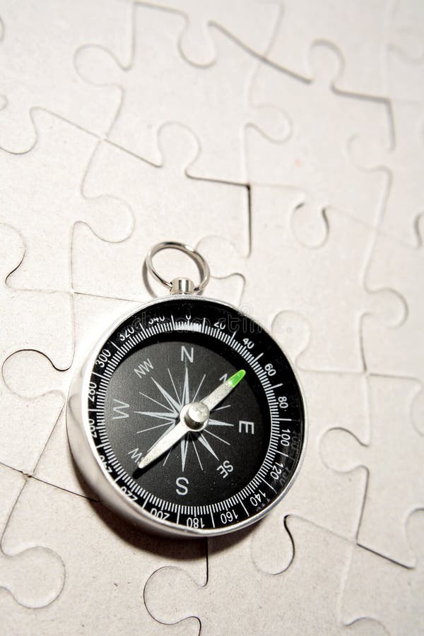 Compass on Puzzle stock photo. Image of closeup, compass - 6728420