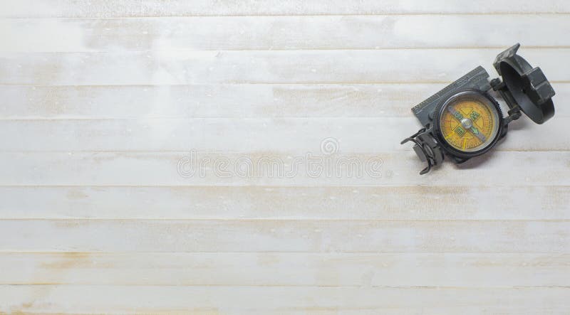 Compass on a White Wooden Floor with Empty Space Stock Image - Image of ...