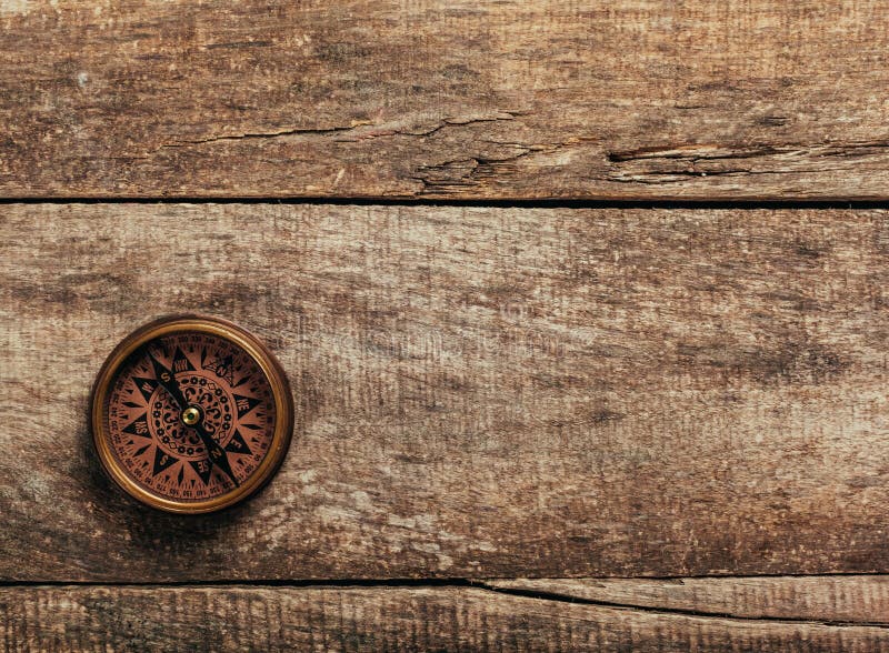 Compass on a wood deck stock image. Image of sign, geography - 72930485