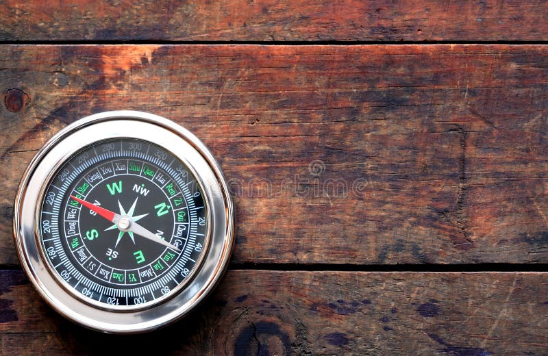 Compass on Wood stock photo. Image of travel, magnet - 65071332