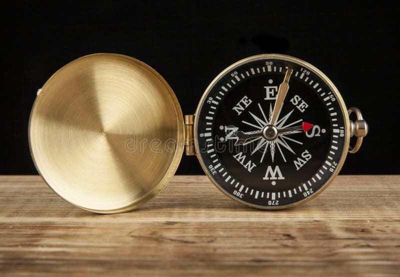 Compass on wooden table stock image. Image of brown, discovery - 66136435