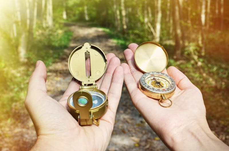 Compasses in the hands stock photo. Image of hand, compass - 50558828