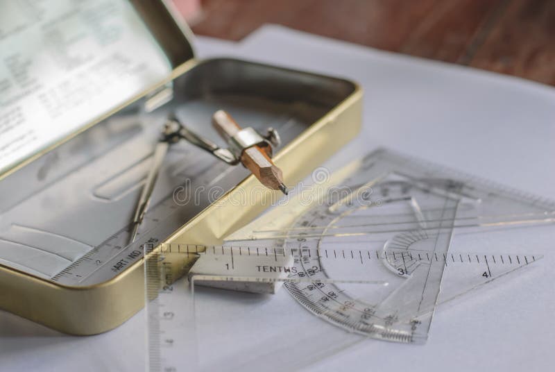 Compasses, Pencil and Rulers on Squared Paper Stock Image - Image of ...