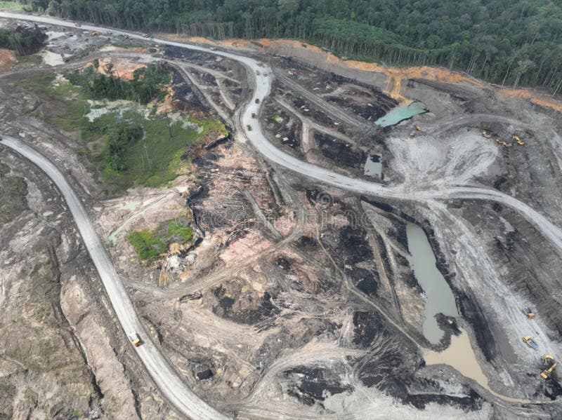 Dynamic Aerial Shot of Open-Pit Mining and Forest Boundary in West ...