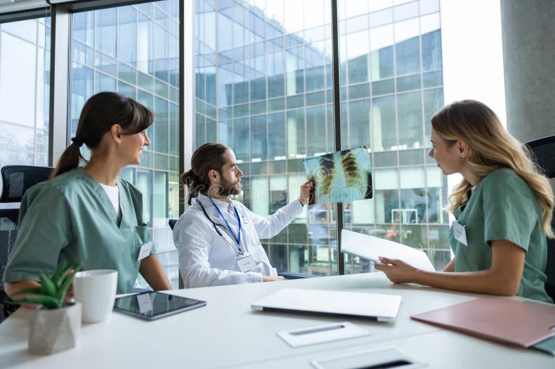 Competent Doctors Looking at X-ray at Doctor S Office Stock Photo ...