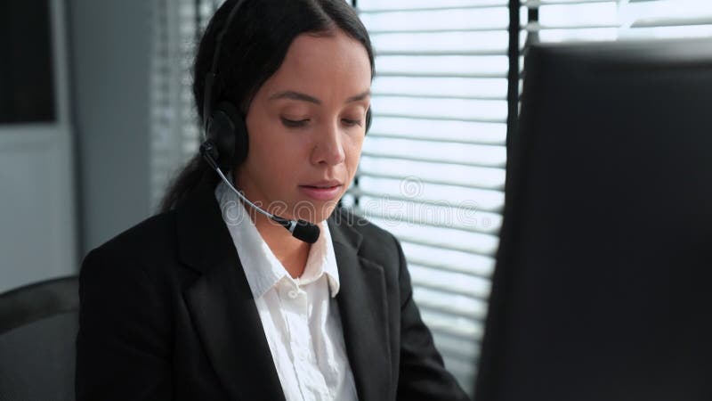 Competent Female Operator Working on Computer and while Talking with ...