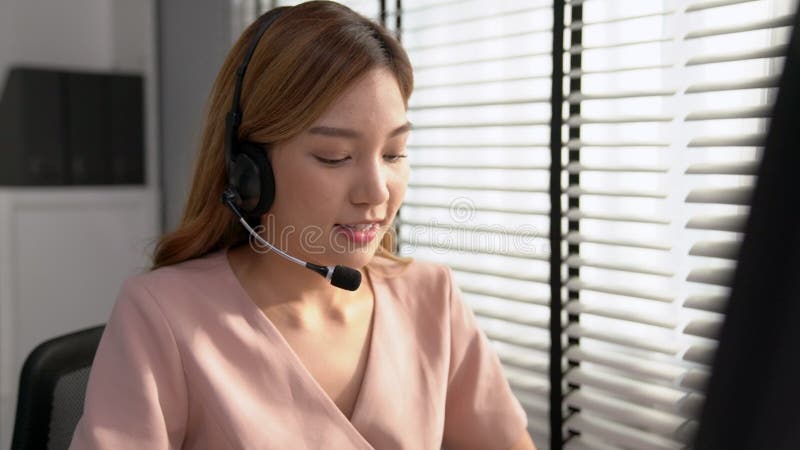 Competent Female Operator Working on Computer and while Talking with ...