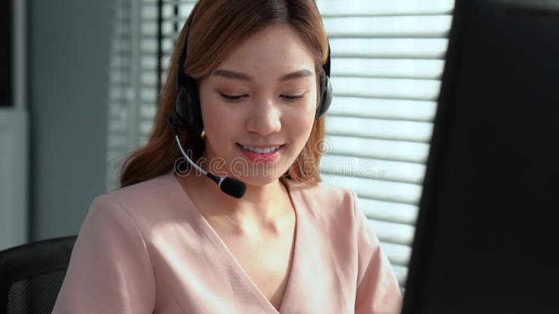 Competent Female Operator Working on Computer and while Talking with ...