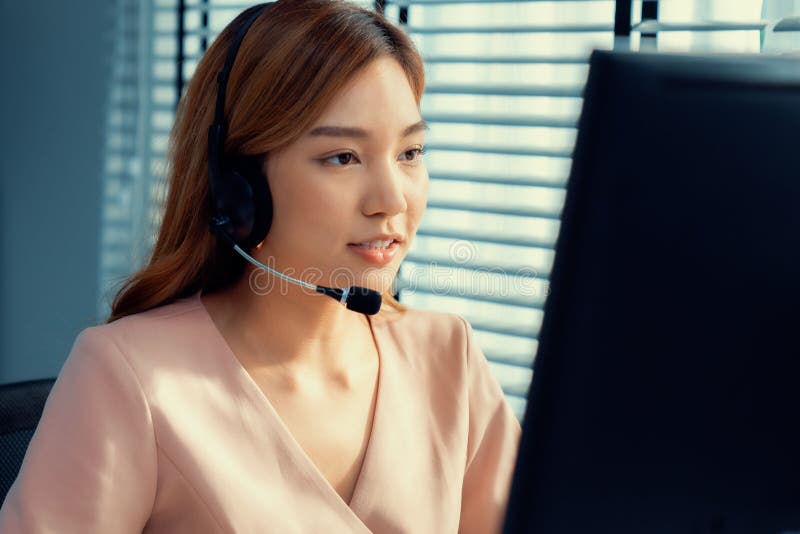 Competent Female Operator Working on Computer and while Talking with ...