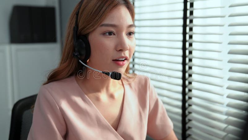 Competent Female Operator Working on Computer and while Talking with ...