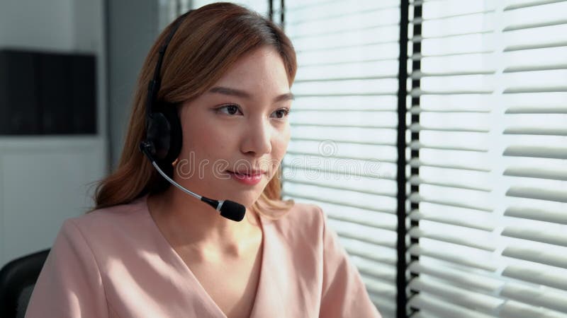 Competent Female Operator Working on Computer and while Talking with ...