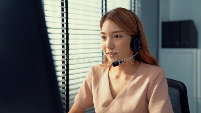 Competent Female Operator Working on Computer and while Talking with ...