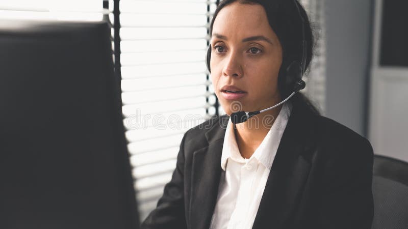 Competent Female Operator Working on Computer and while Talking with ...
