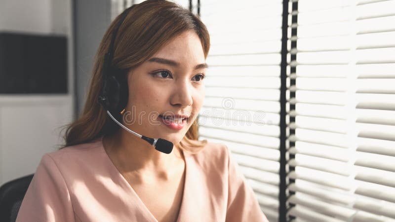 Competent Female Operator Working on Computer and while Talking with ...