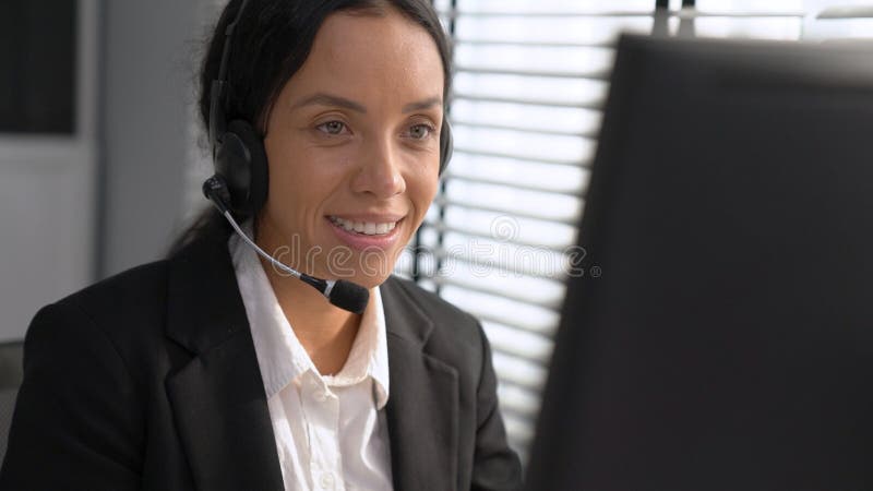 Competent Female Operator Working on Computer and while Talking with ...