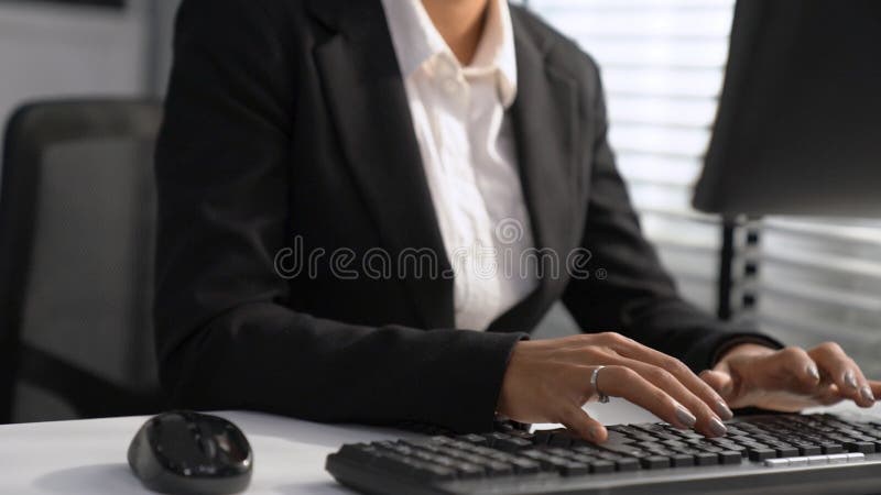 Competent Female Operator Working on Computer and while Talking with ...