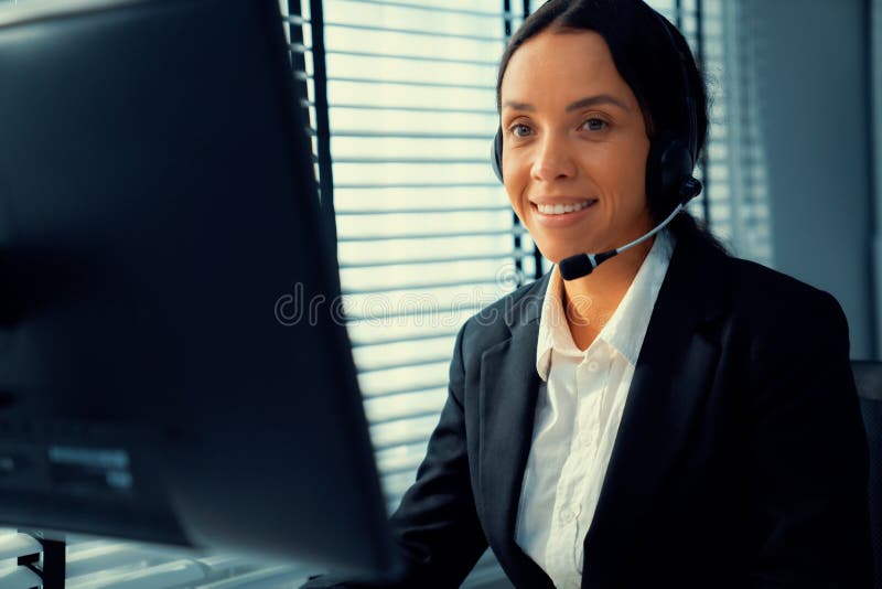 Competent Female Operator Working on Computer and while Talking with ...