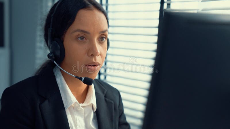 Competent Female Operator Working on Computer and while Talking with ...